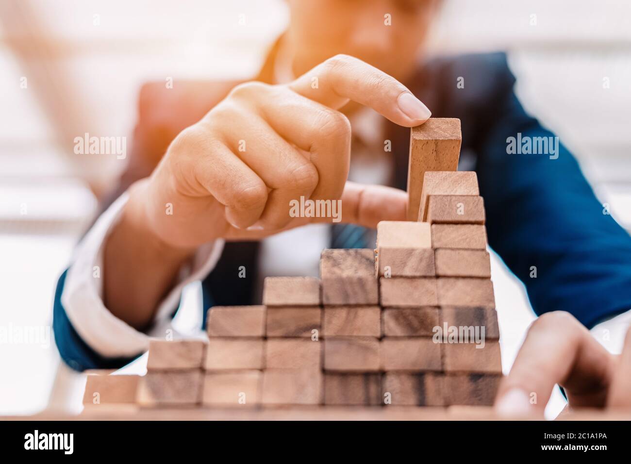 Ant eye view Male hand stacking wooden blocks. Business development and ...