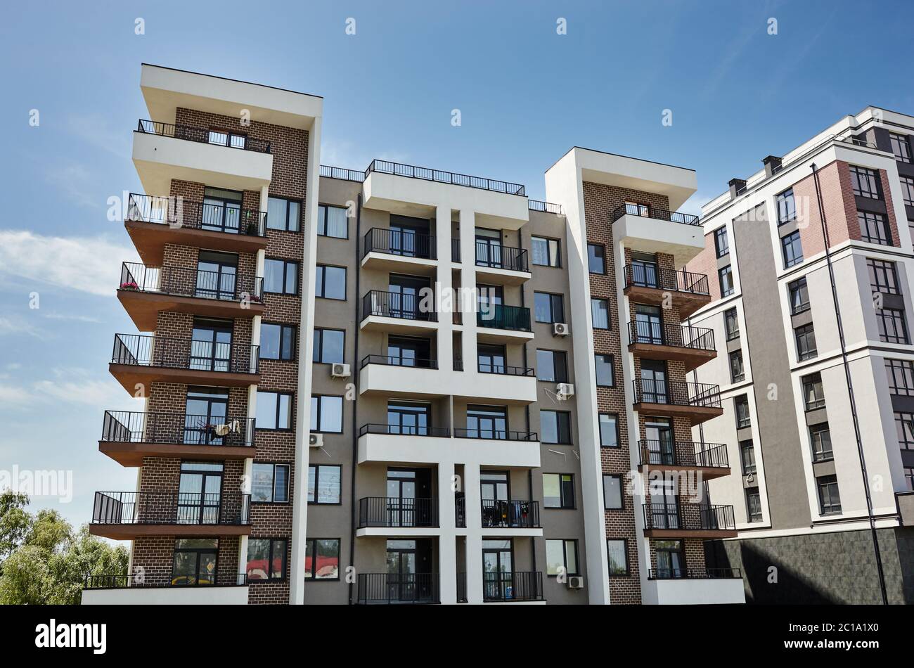Modern European residential apartment buildings quarter on a sunny day ...