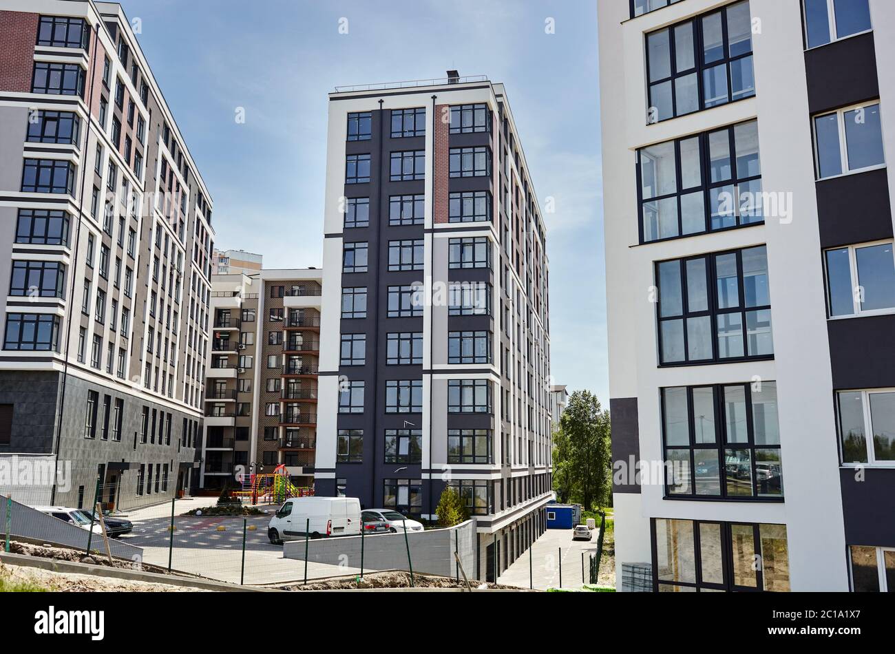 Modern European residential apartment buildings quarter on a sunny day ...