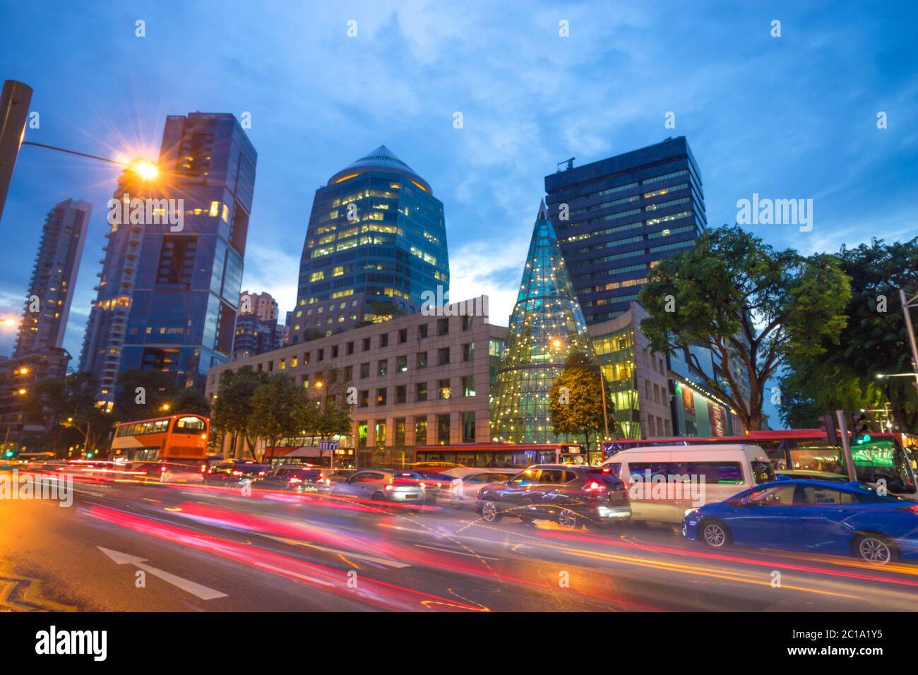 busy road and modern buildings in modern city Stock Photo - Alamy