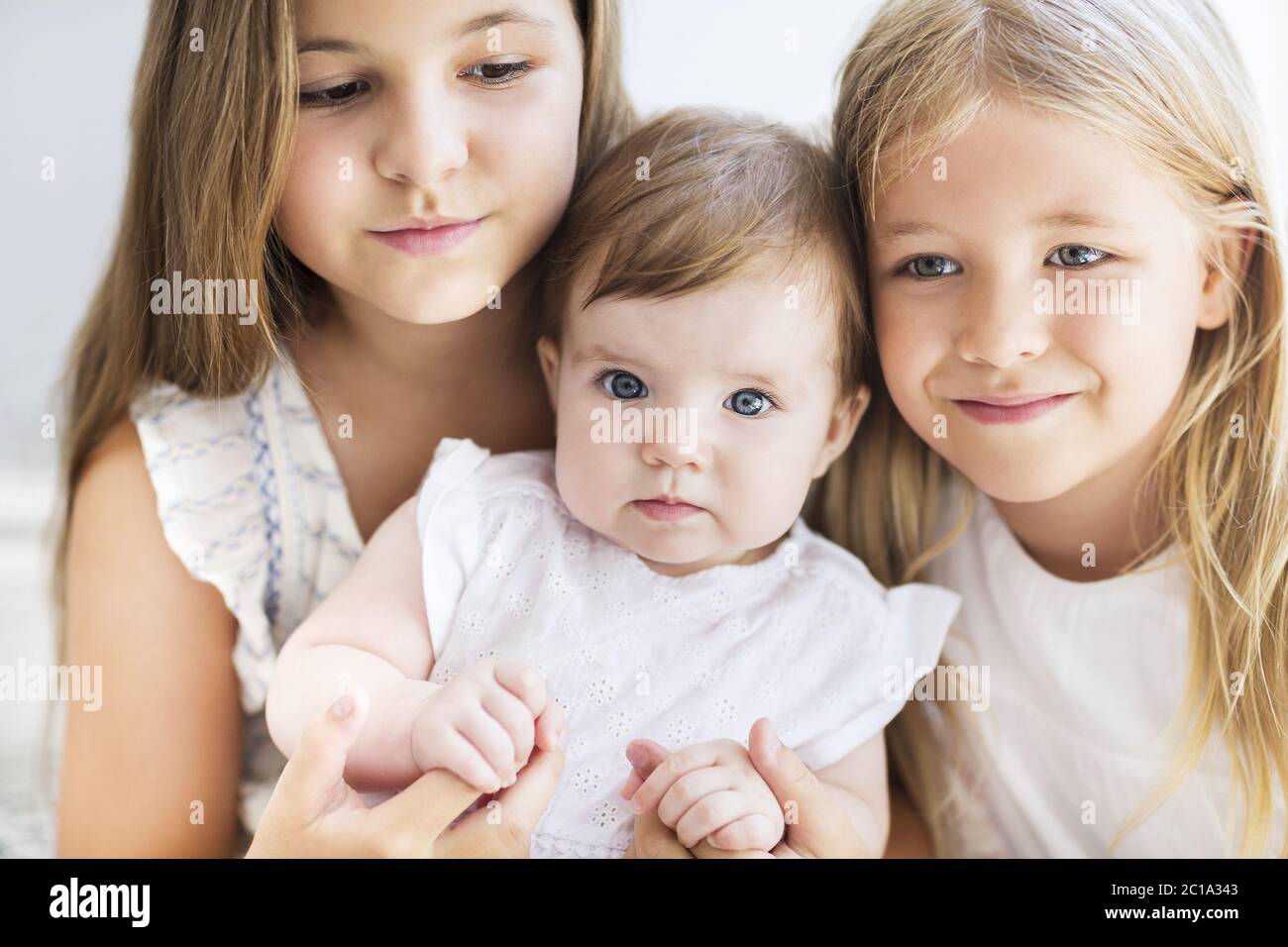Three pretty little blond girls Stock Photo - Alamy
