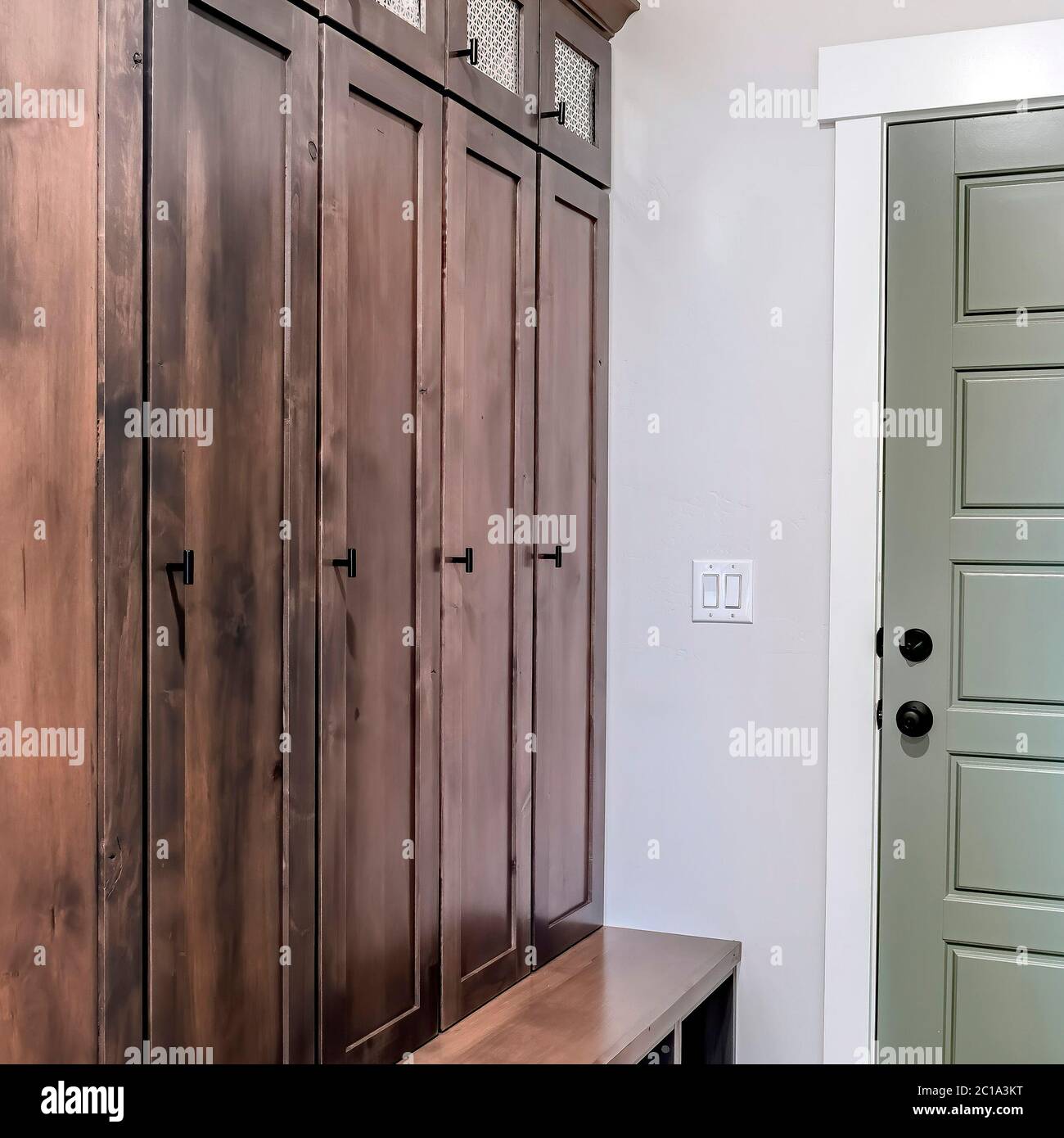 Square Home interior with fire door adjacent to the tall vintage wooden ...