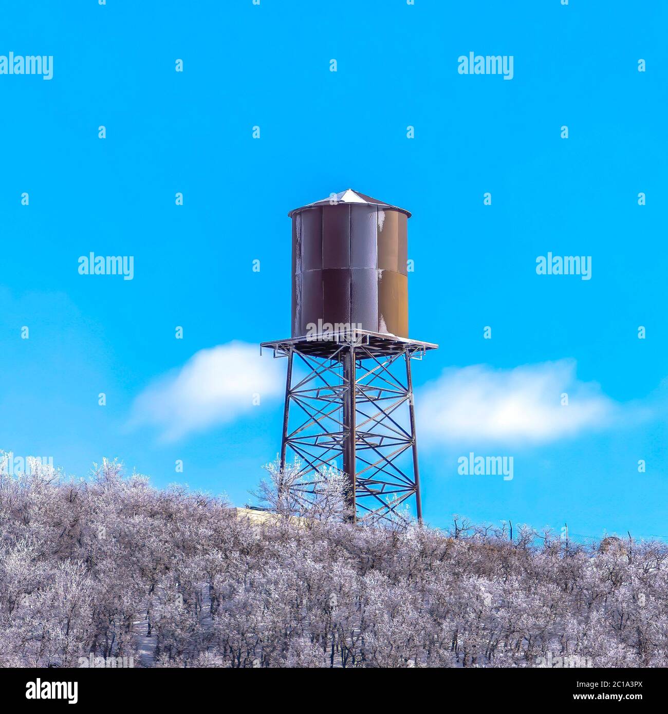 Square Cylindrical water storage tank container on a steel tower at ...