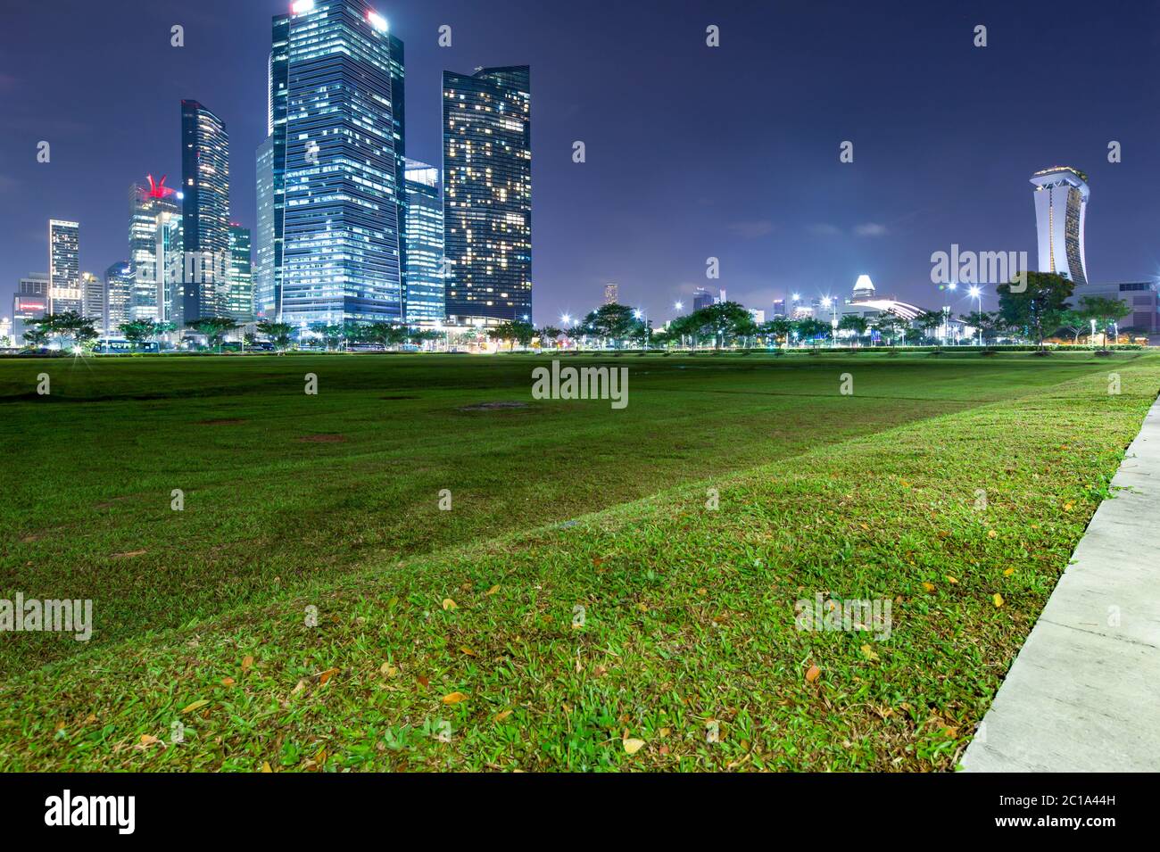green grass land near modern buildings Stock Photo - Alamy
