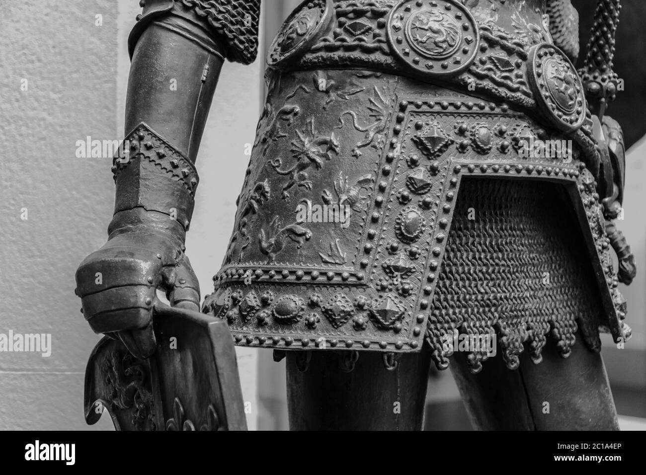Hand in armour of the medieval knight statue Stock Photo - Alamy