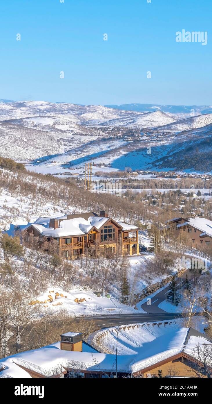 Vertical crop Luxurious homes in Park City on mountain landscape ...