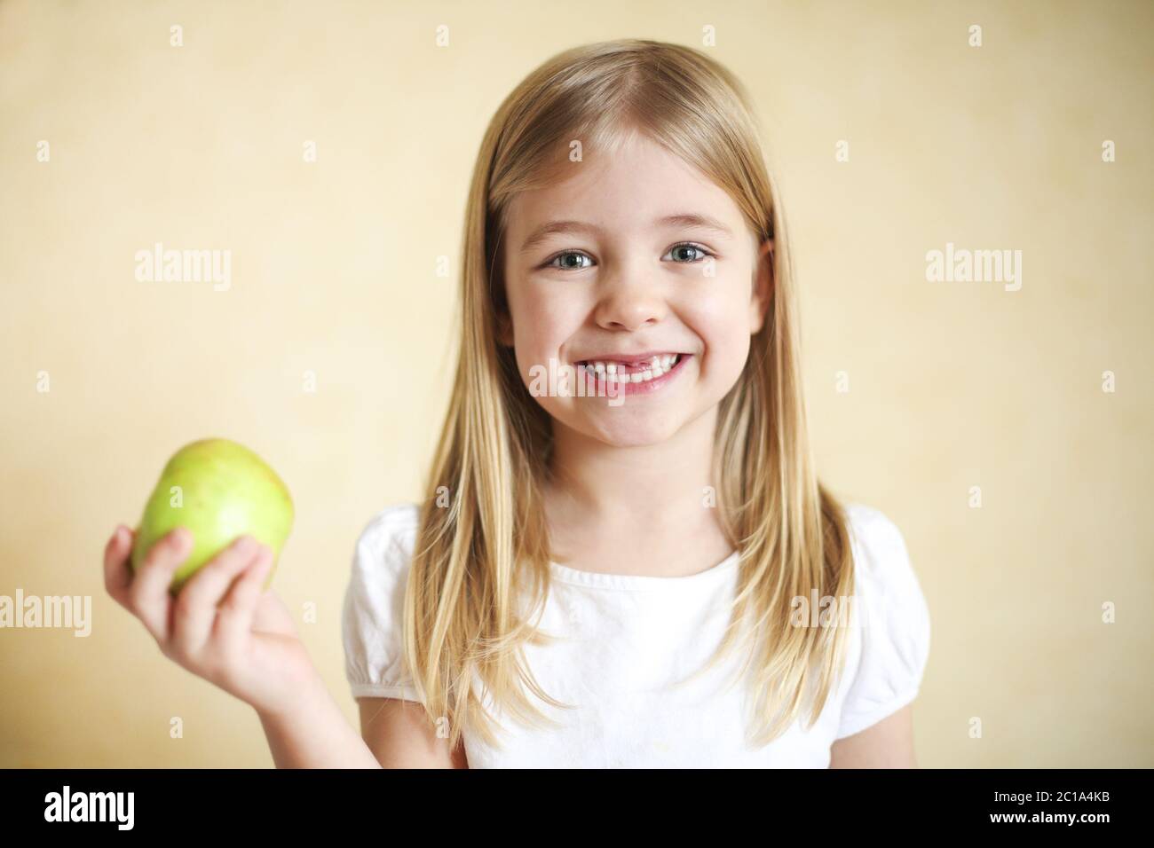 Funny smiling kid eating apple hi-res stock photography and images - Alamy
