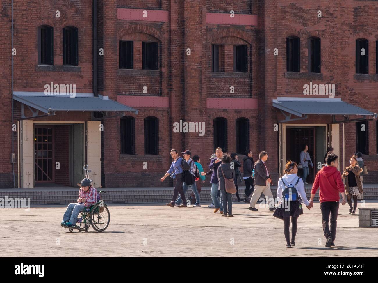 Visitors at the historic Yokohama Red Brick Warehouse building, Japan ...