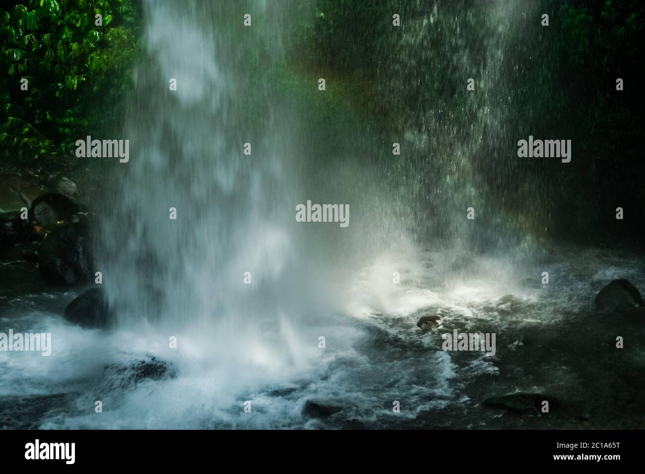 Small waterfall in the dense jungle Stock Photo - Alamy