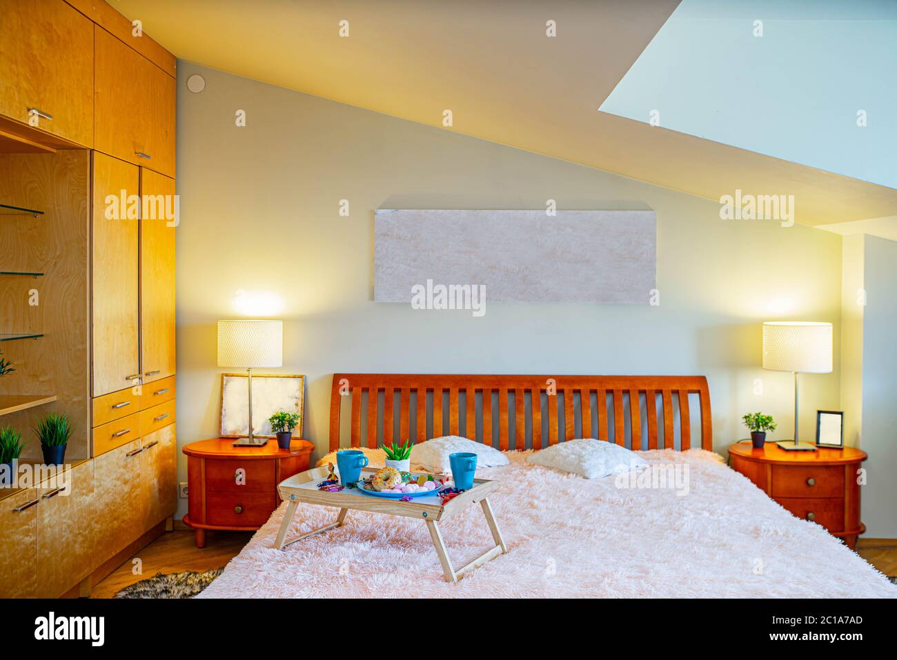 Modern interior of luxury bedroom with furniture. Front view of wooden ...