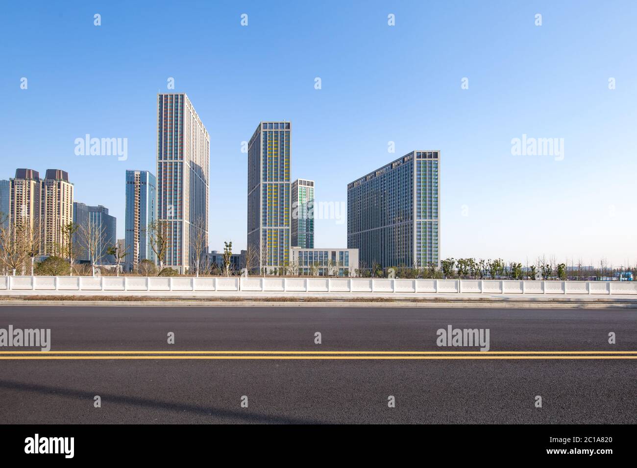 modern buildings near road in modern city Stock Photo - Alamy
