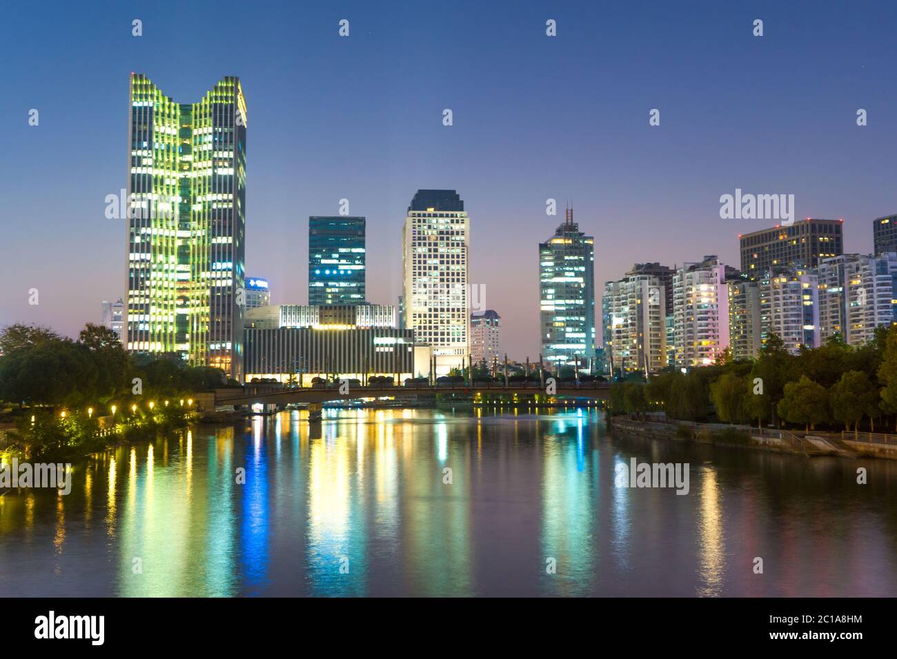 modern buildings near river in modern city Stock Photo - Alamy