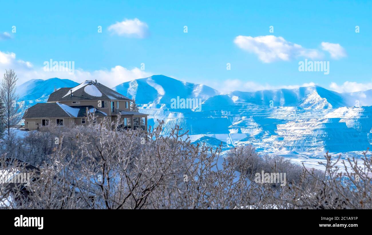 Panorama crop Magnificent Wasatch Mountains in winter with lovely homes ...
