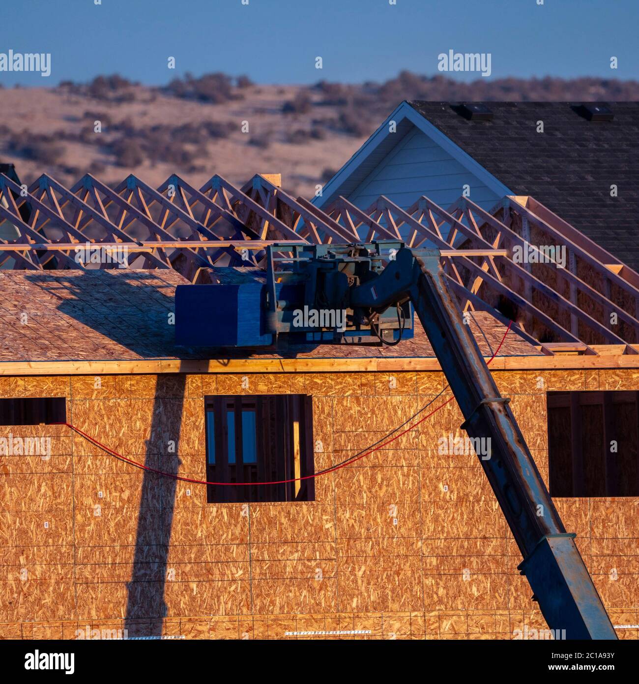Square frame Roofers fitting a new roof to an urban house Stock Photo ...