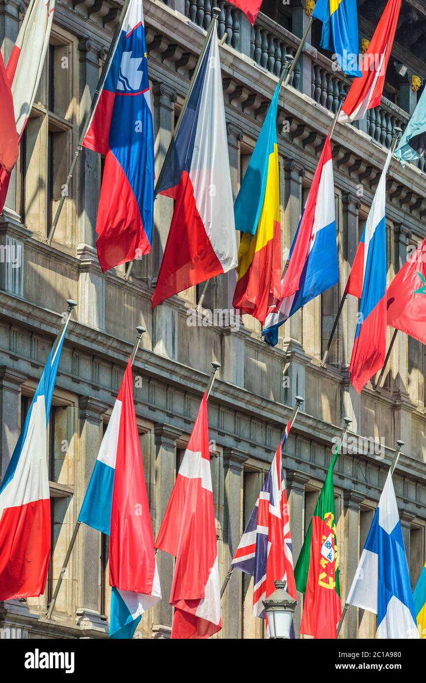Different flags hanging on the center town hall in Antwerp, Belgium ...