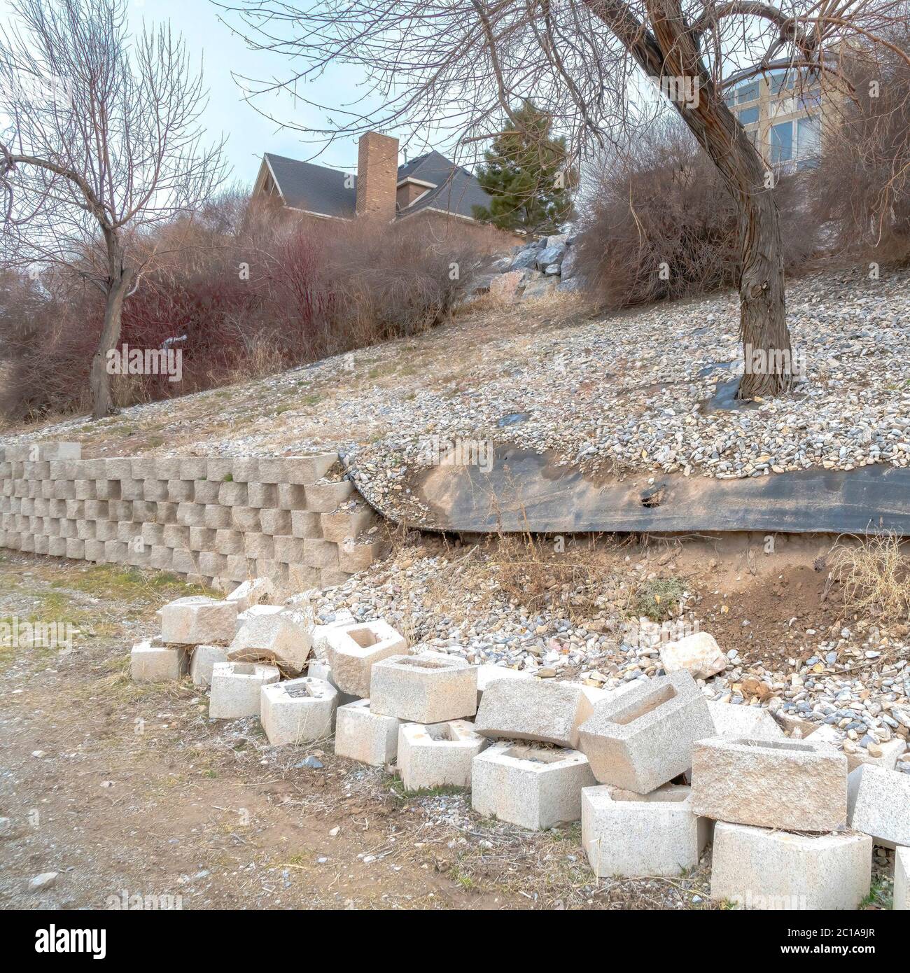 Square frame Stone blocks of collapsed retaining wall holding the soil ...