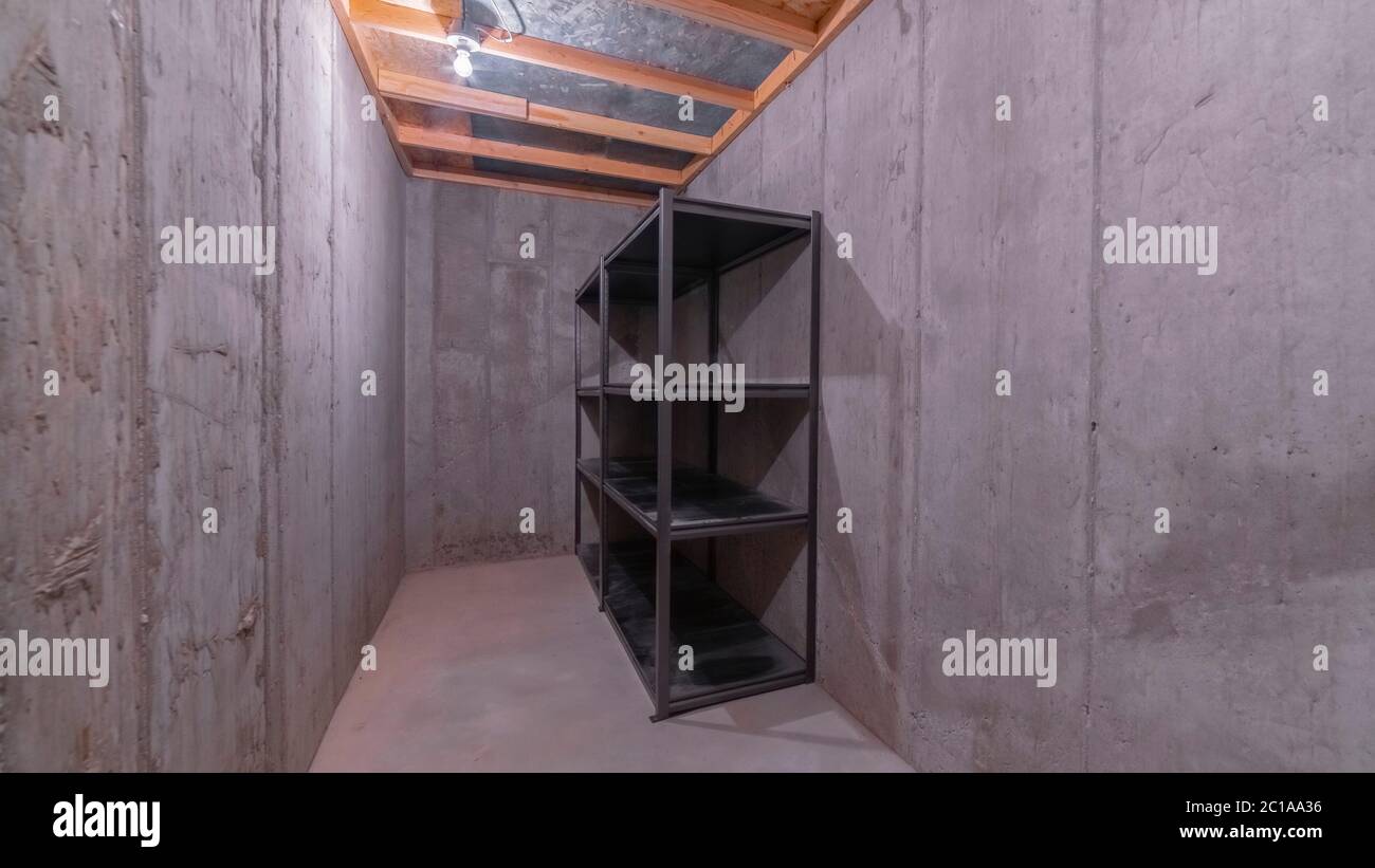 Panorama frame Storage shelves in a bare concrete room Stock Photo - Alamy