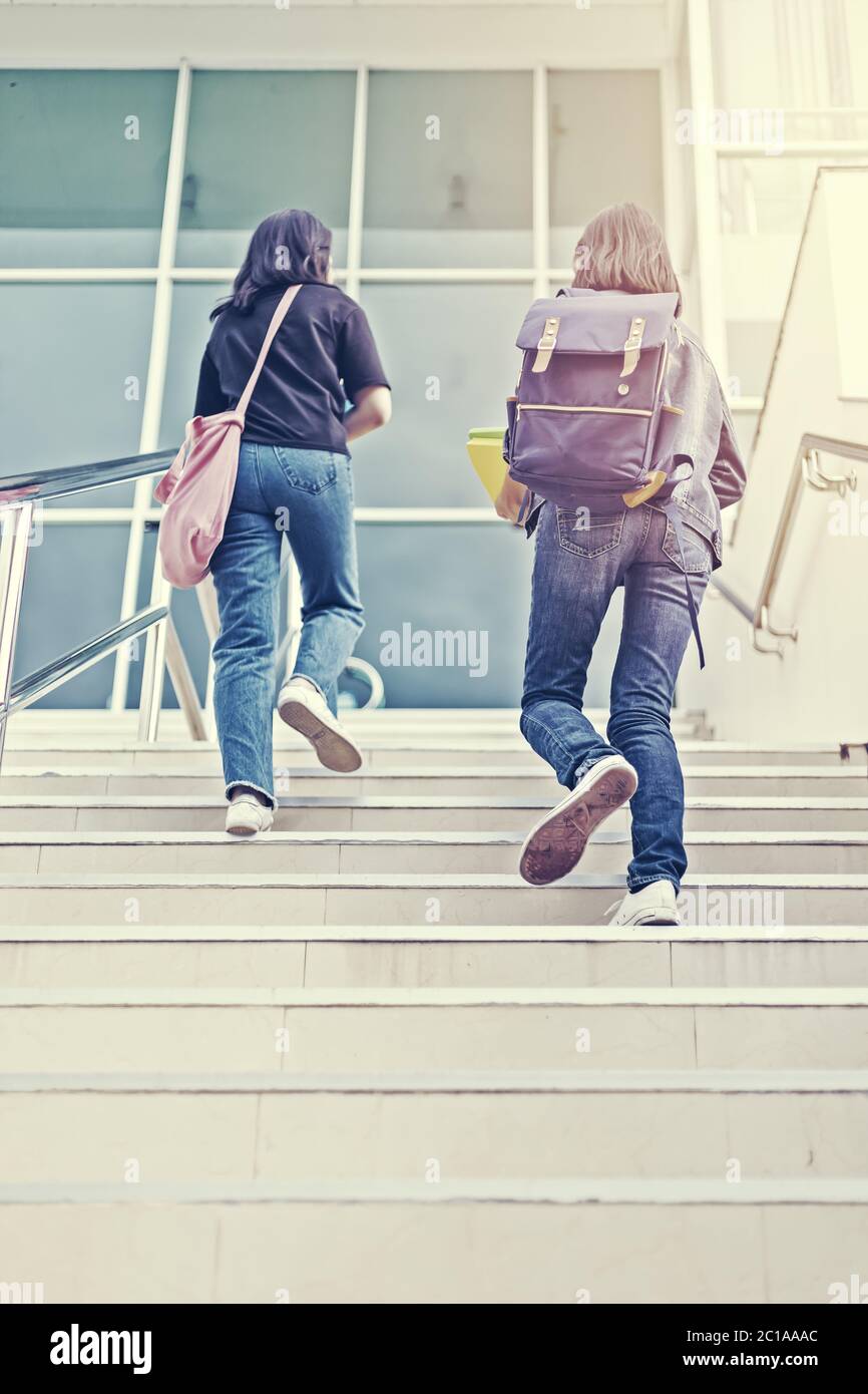 college student walking up the staircase Stock Photo - Alamy