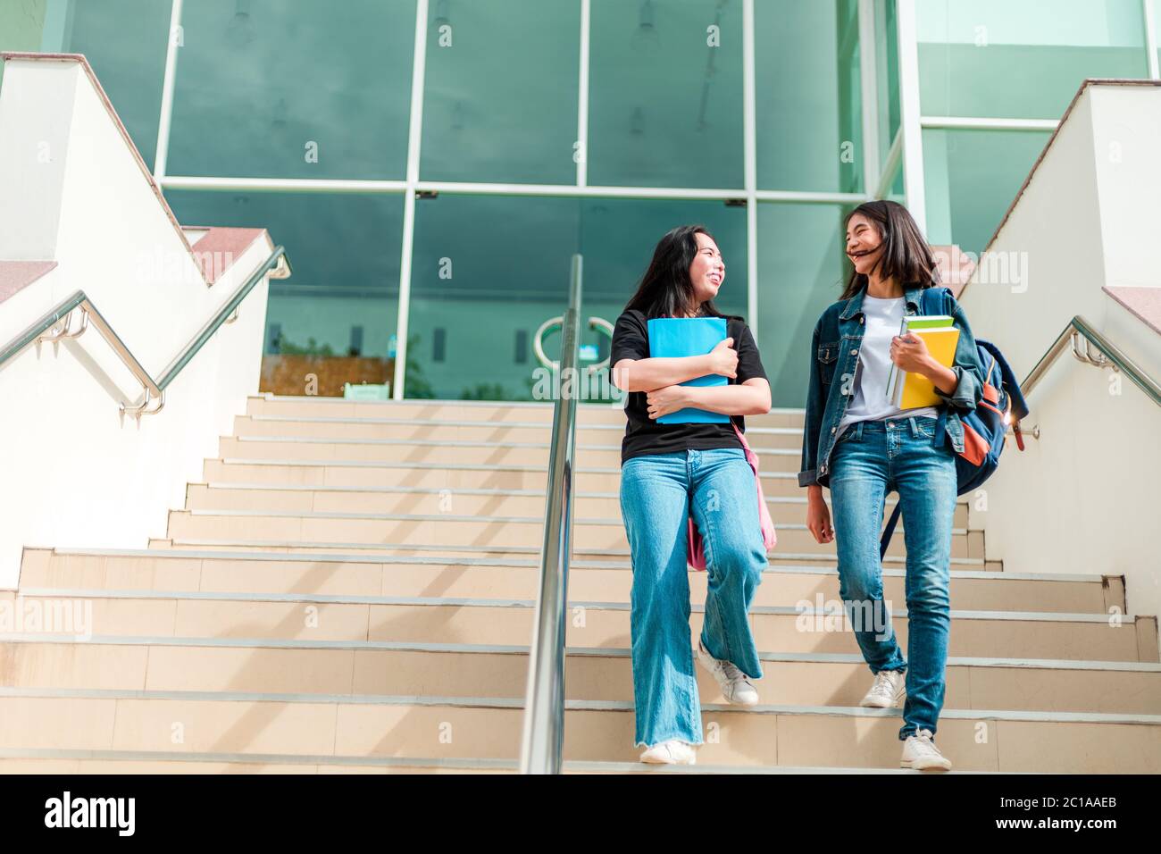 college student walking up the staircase Stock Photo - Alamy