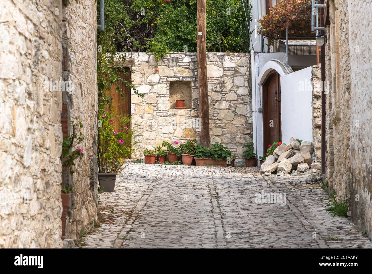 Narrow street in tourist ancient village of Lania, Cyprus Stock Photo ...