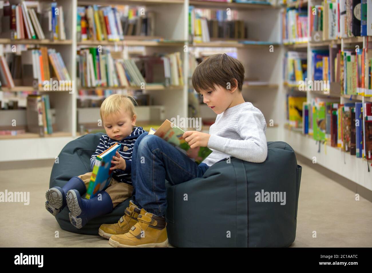 Smart children, boy brothers, toddler and school kid, educating ...