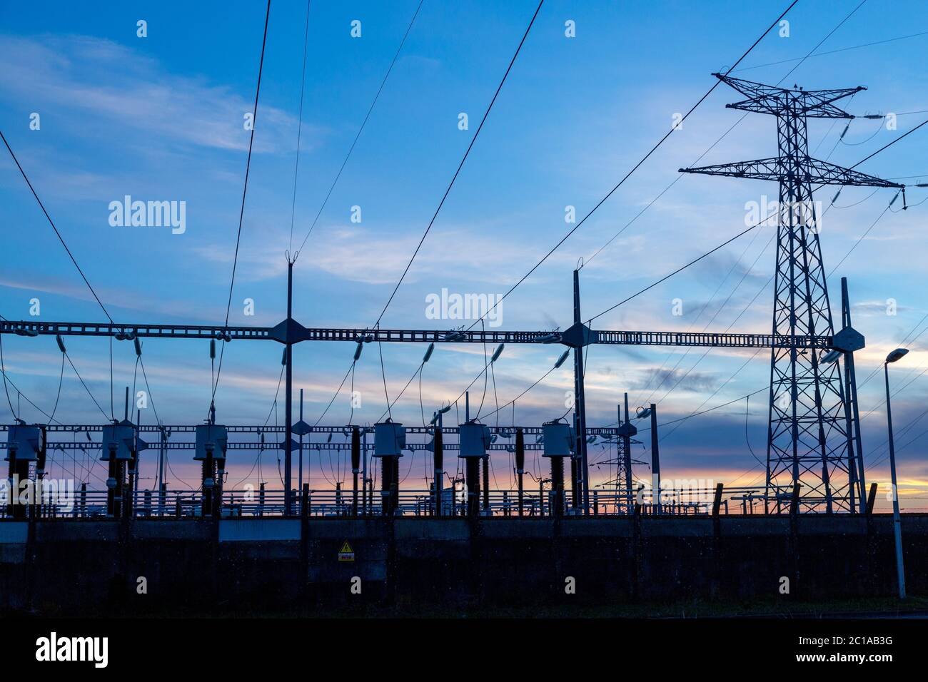 High-voltage power lines at electricity distribution station Stock ...