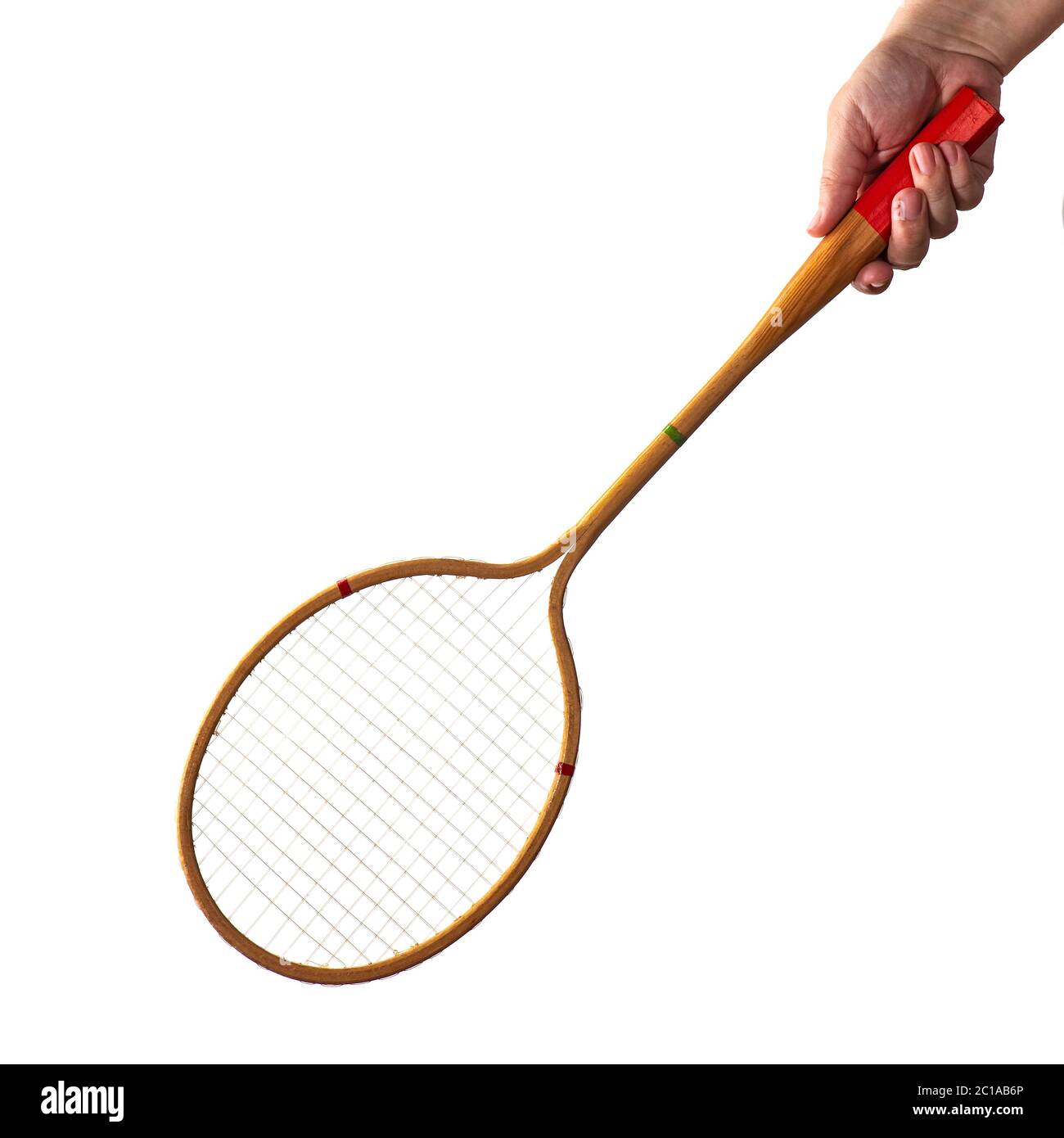 Vintage wooden badminton racket in hand isolated on white background ...