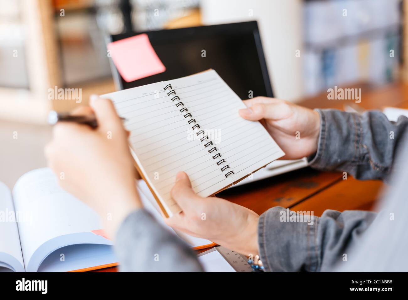 Young pupil desk doing hi-res stock photography and images - Alamy