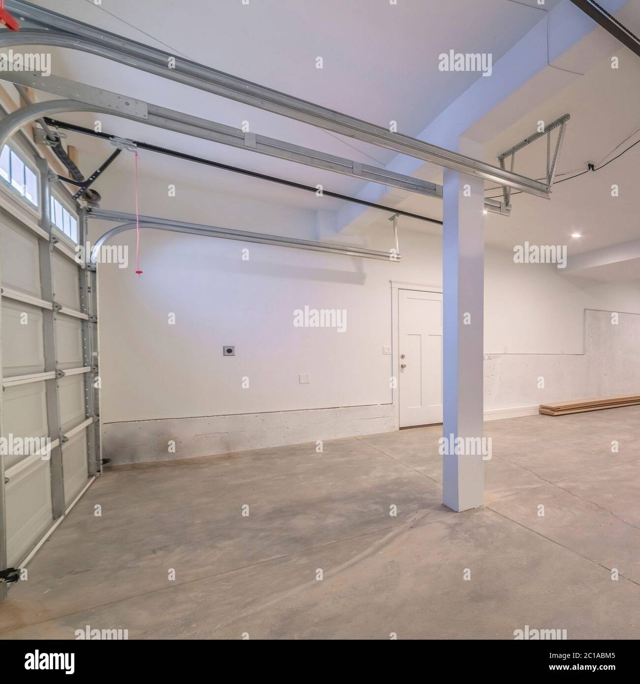 Square frame Empty cement garage interior with shining lights Stock ...