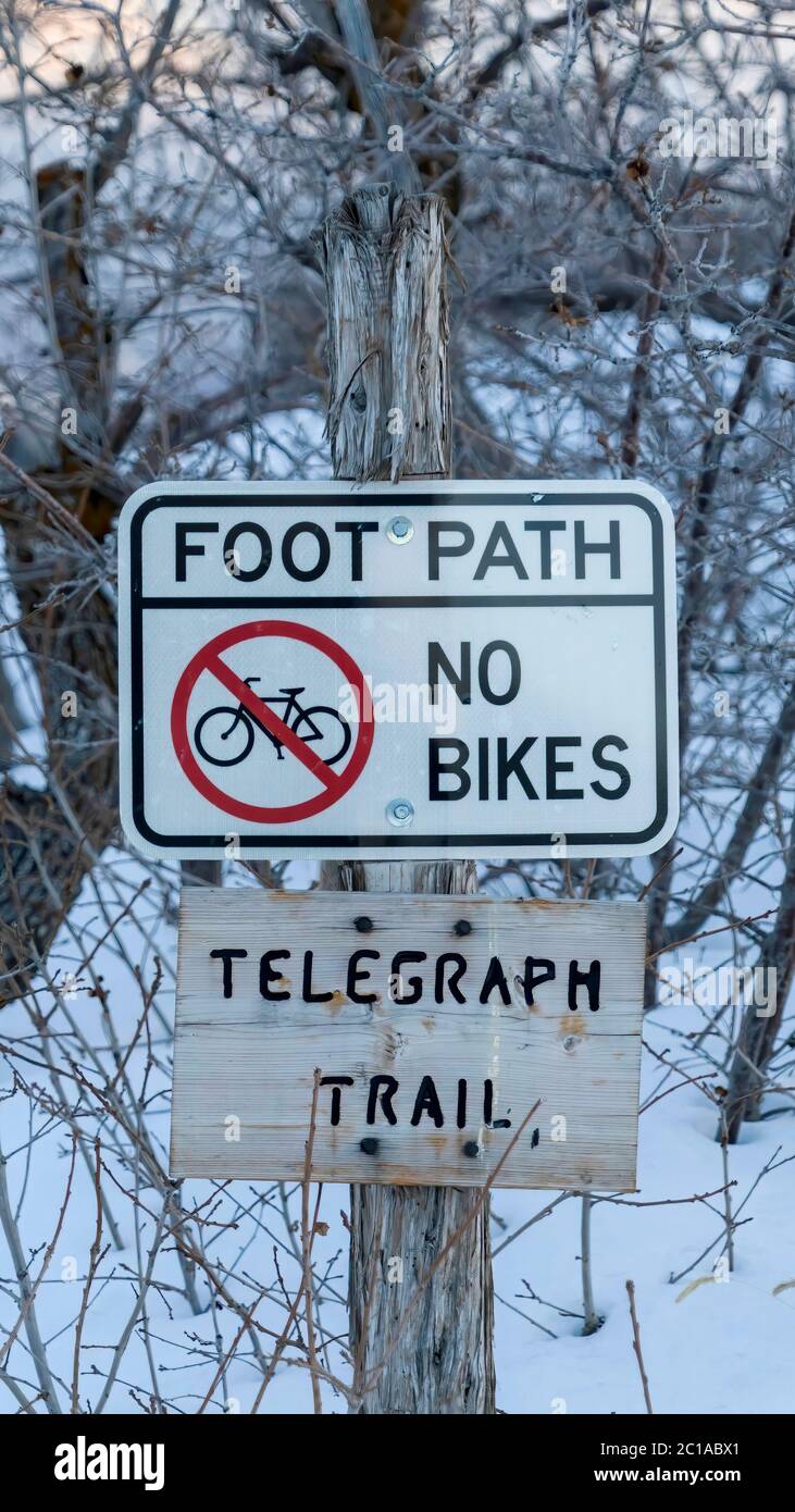 Vertical Signages by a foot path trail at Wasatch Mountains blanketed ...