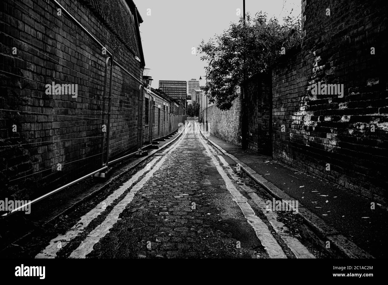Black and white narrow urban street Stock Photo - Alamy