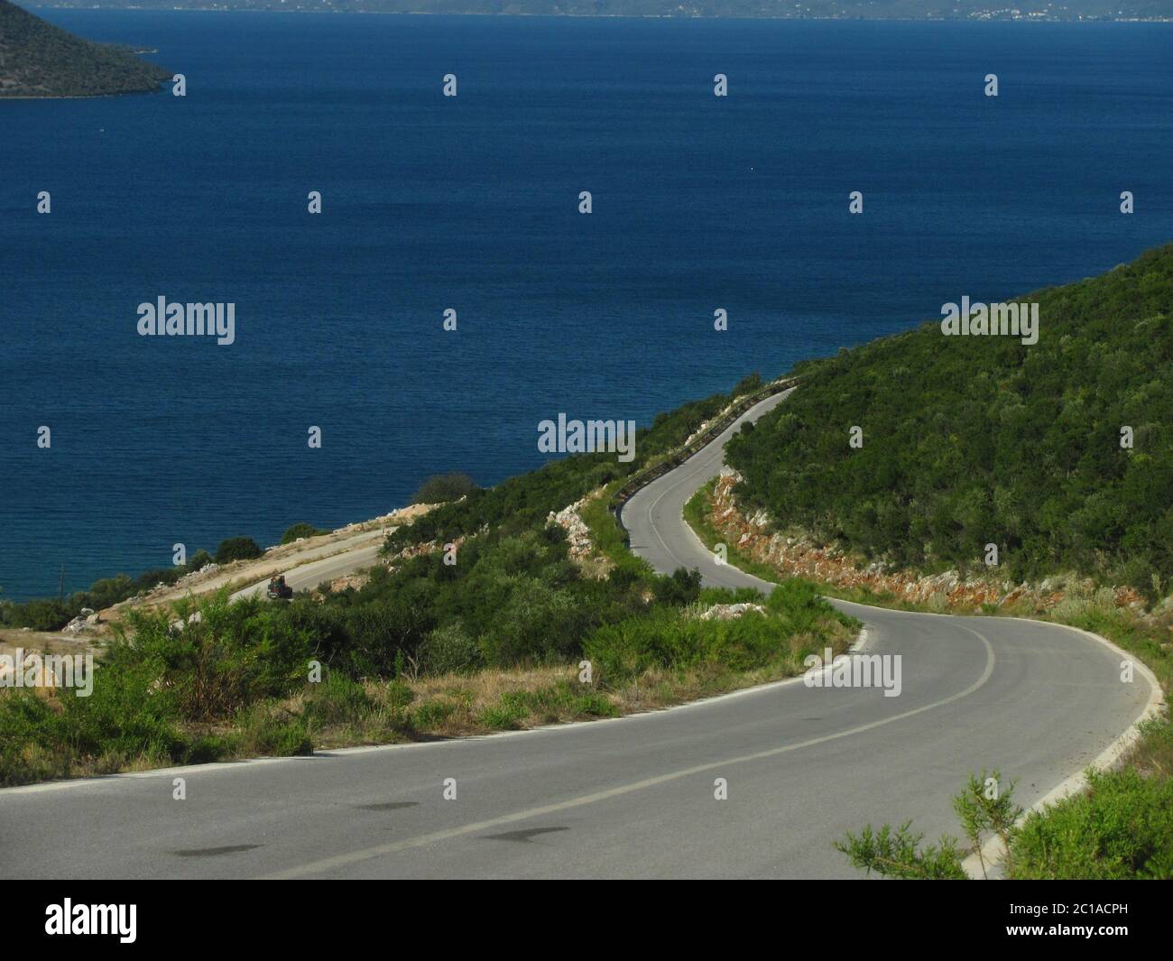 Asphalt road leading sea hi-res stock photography and images - Alamy
