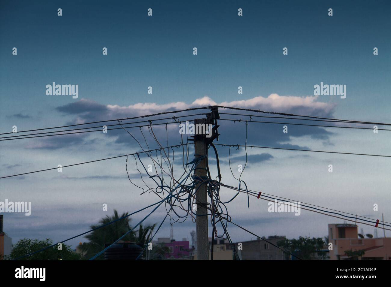 blue clutter electric pole with wires background clouds with green ...
