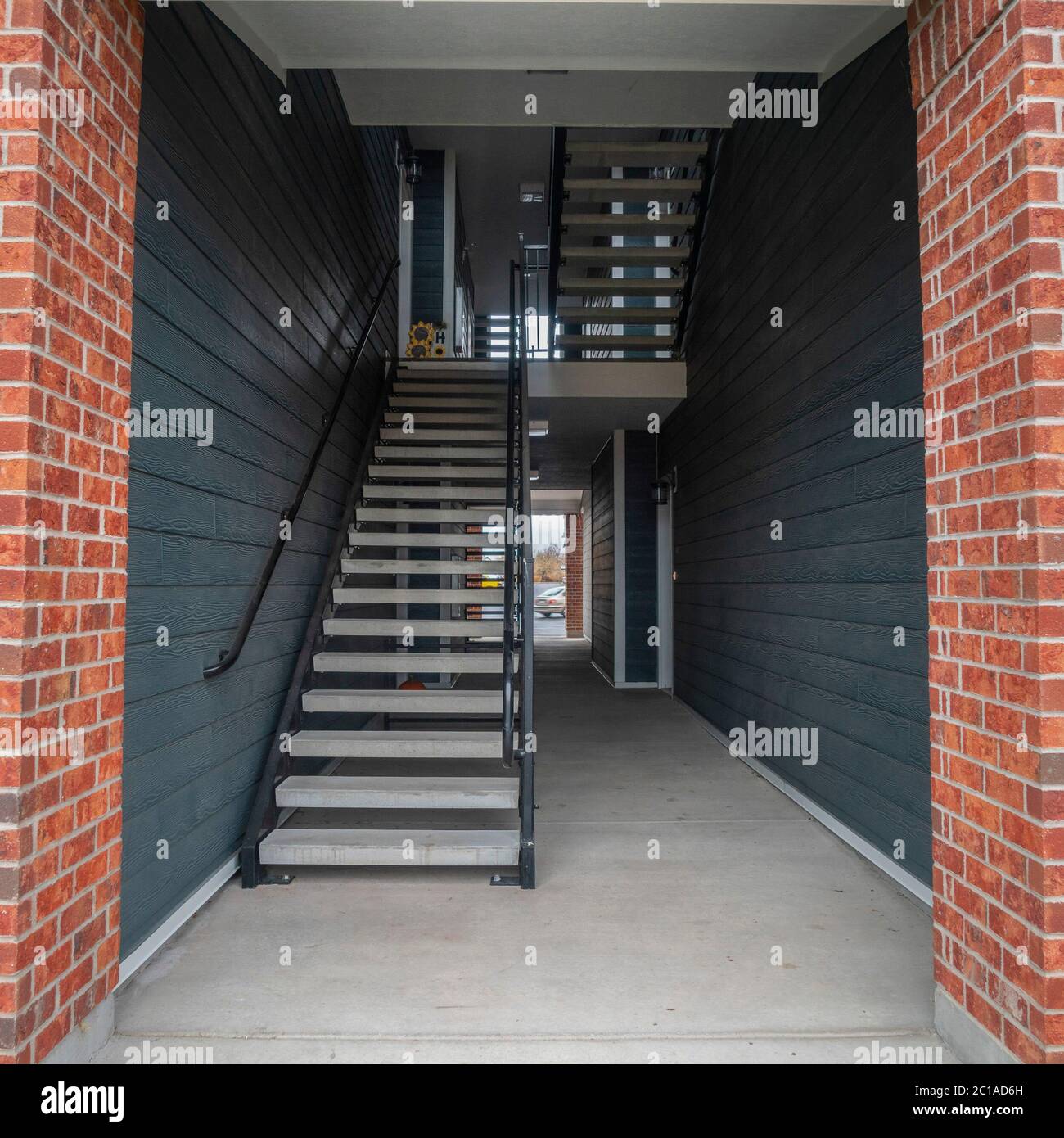 Square frame Internal stairs from a ground floor foyer Stock Photo - Alamy