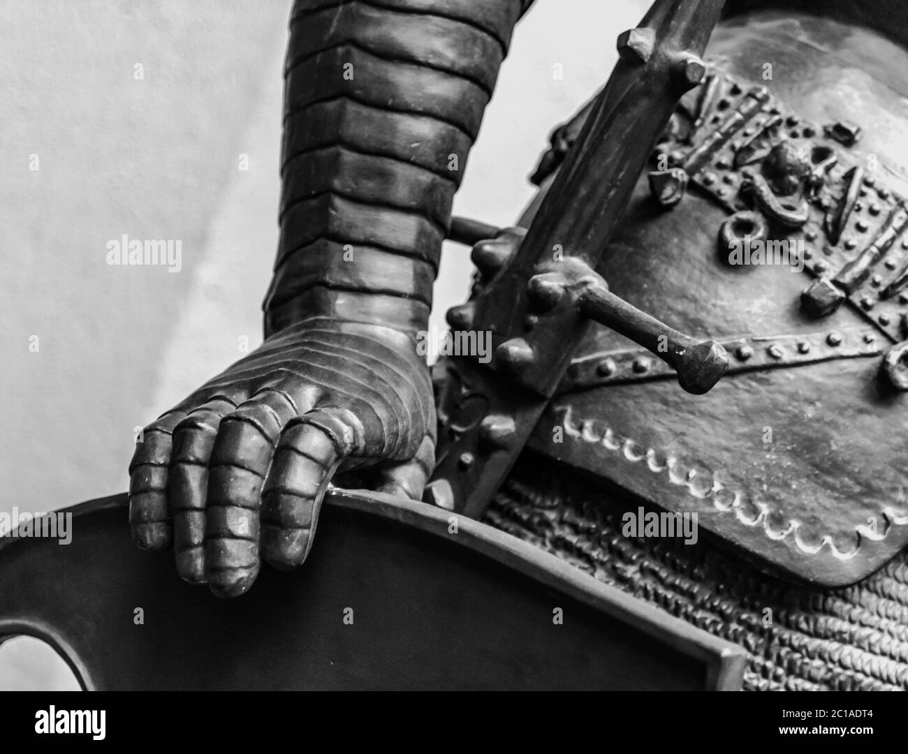 Hand in armour of the medieval knight statue Stock Photo - Alamy