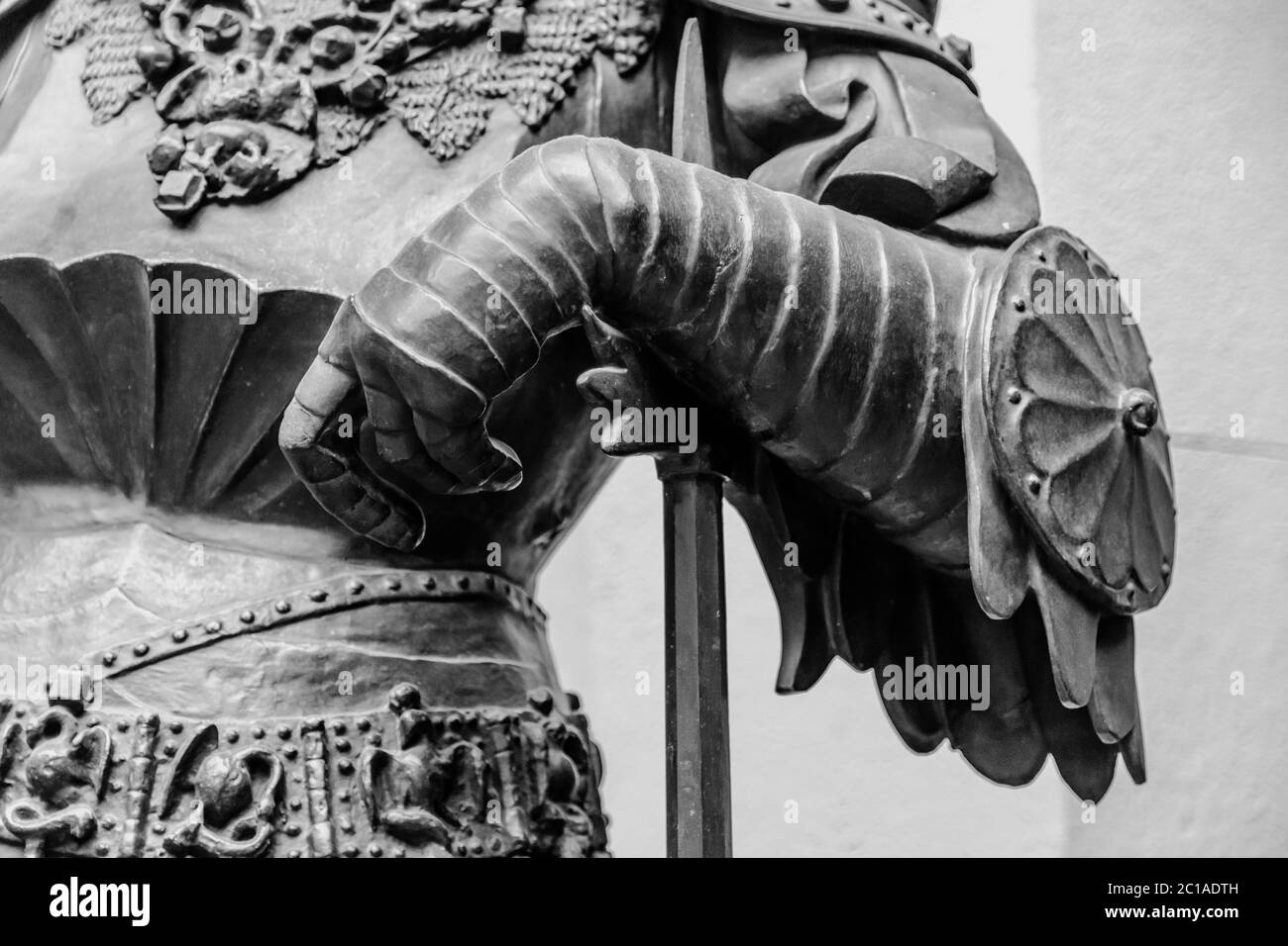 Hand in armour of the medieval knight statue Stock Photo - Alamy