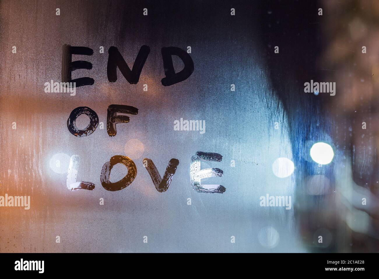 the words end of love handwritten on night wet window glass Stock Photo ...