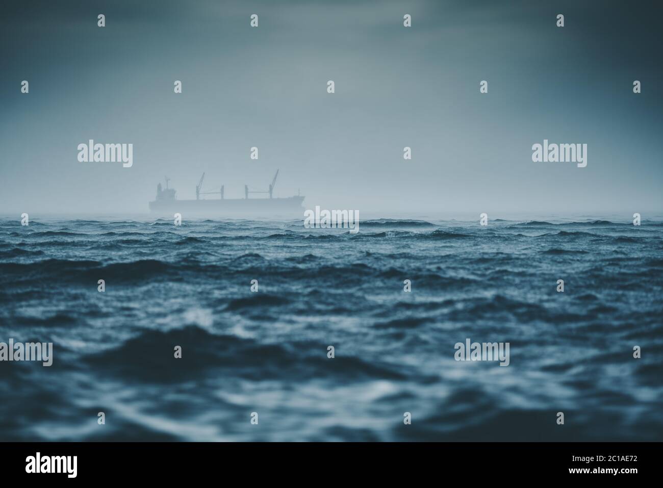 Sea ripple water with rain and ship Stock Photo - Alamy