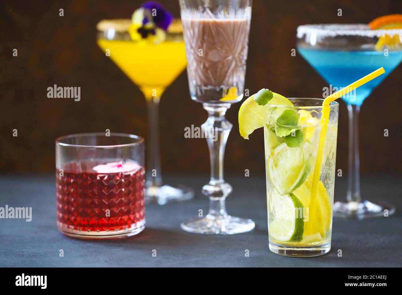 Different cold refreshing cocktails on the table Stock Photo - Alamy
