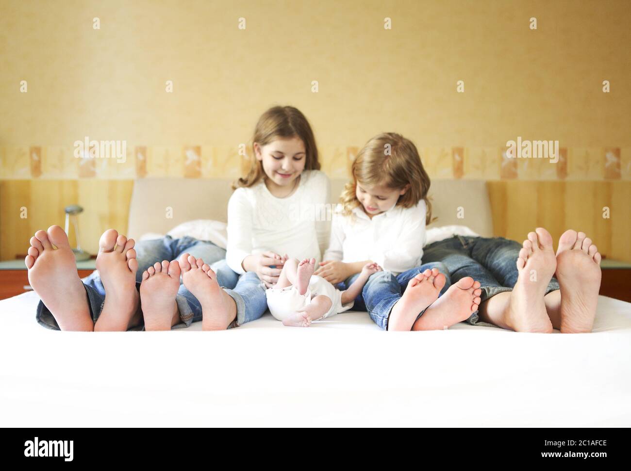 Children feet parents bed hi-res stock photography and images - Alamy