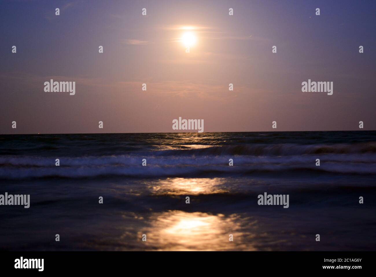 the moon reflected on the sea Stock Photo - Alamy