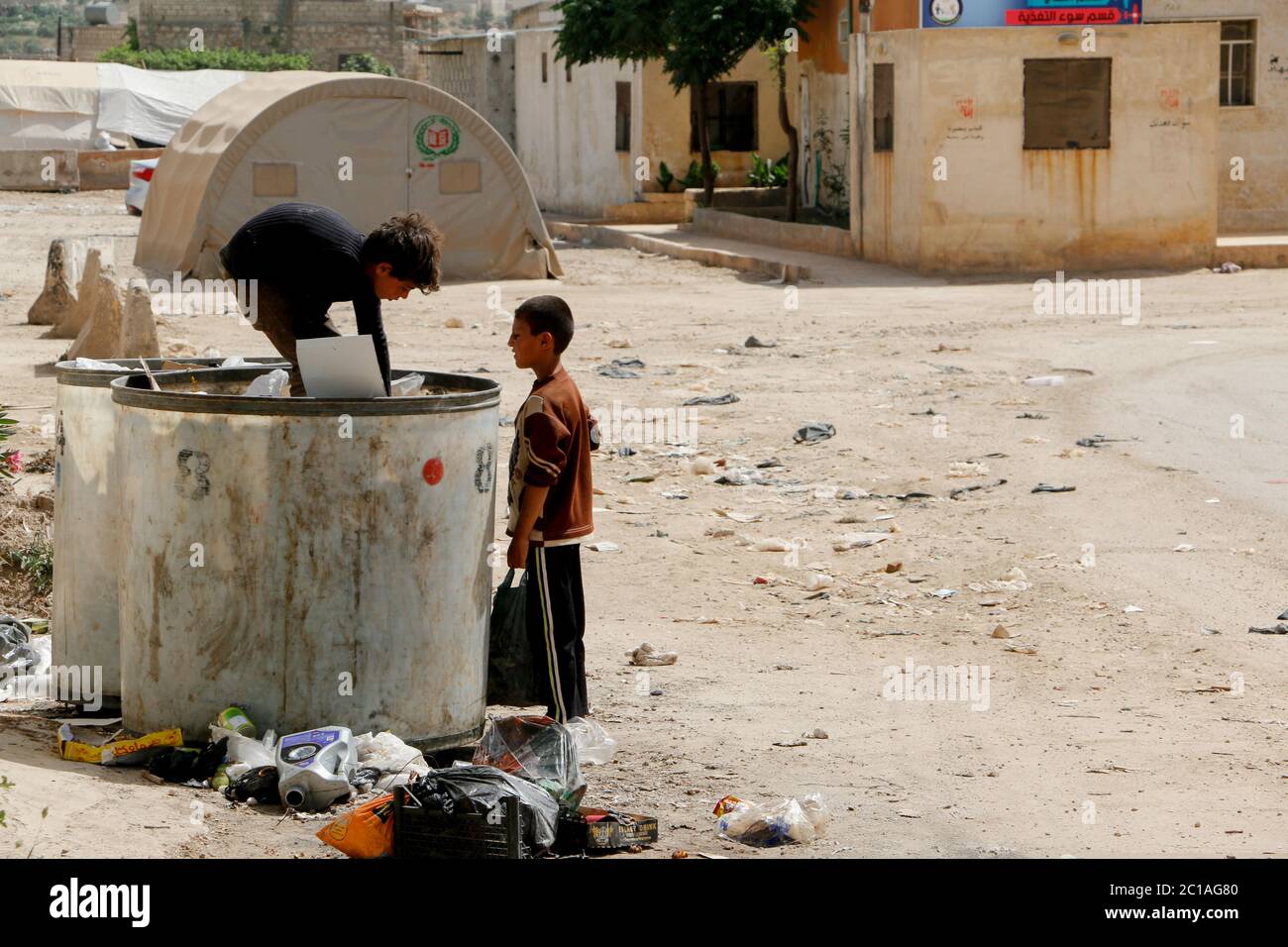 May 19, 2020: Sarmada, Syria. 22 May 2020. Two children scavenge in the ...