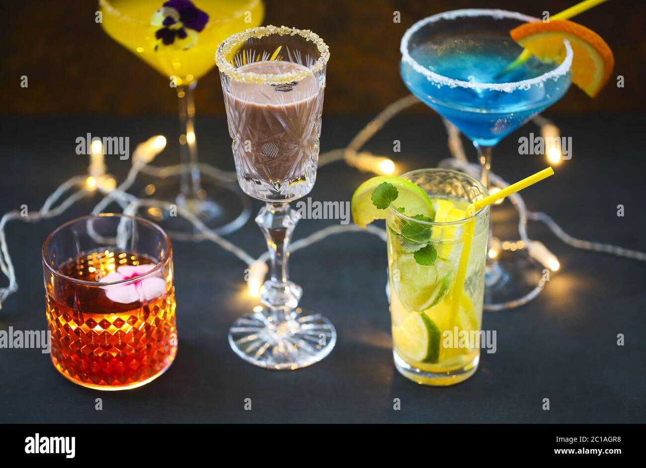 Different cold refreshing cocktails on the table Stock Photo - Alamy