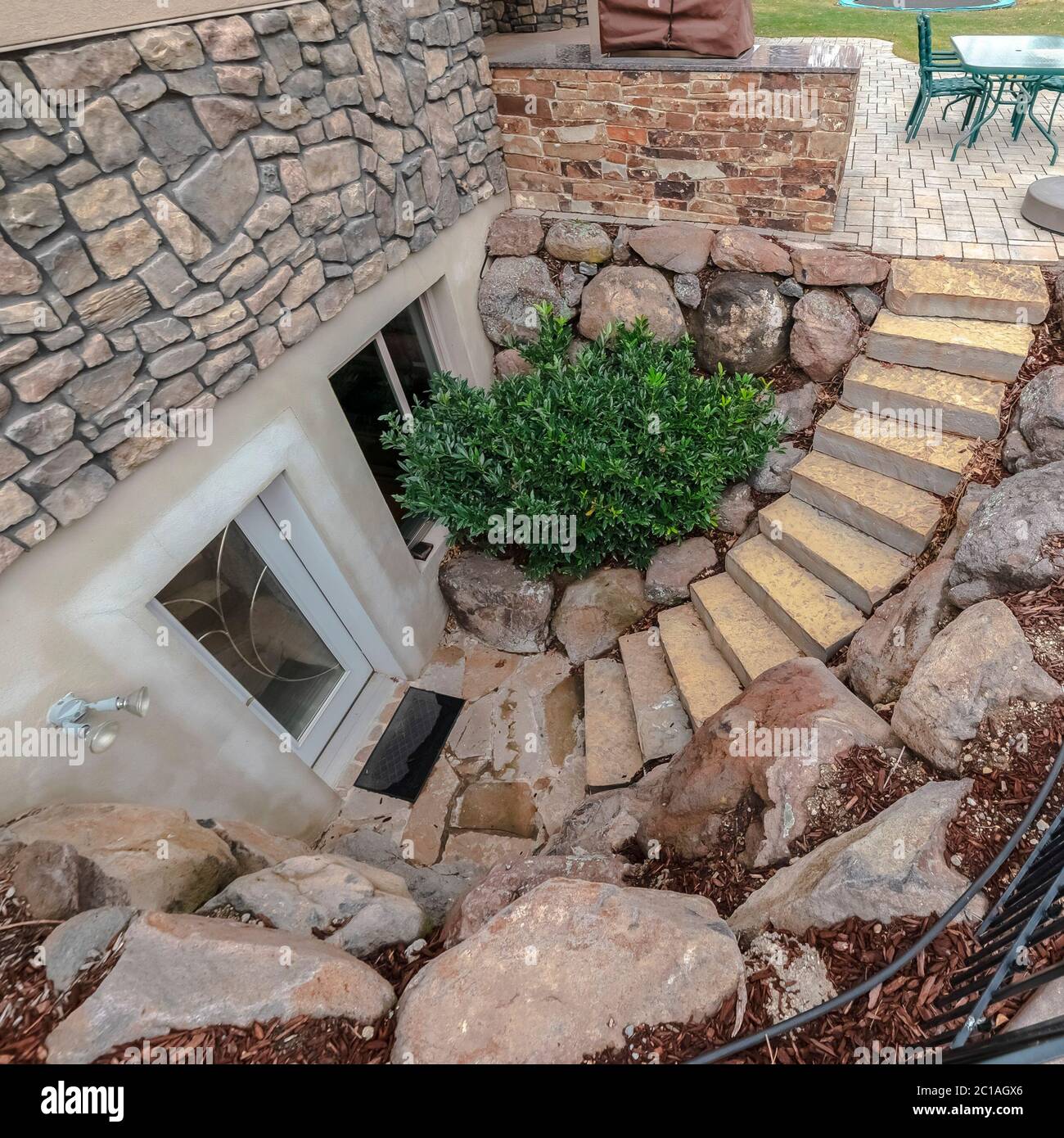 Square crop Steps leading down to a basement apartment Stock Photo - Alamy