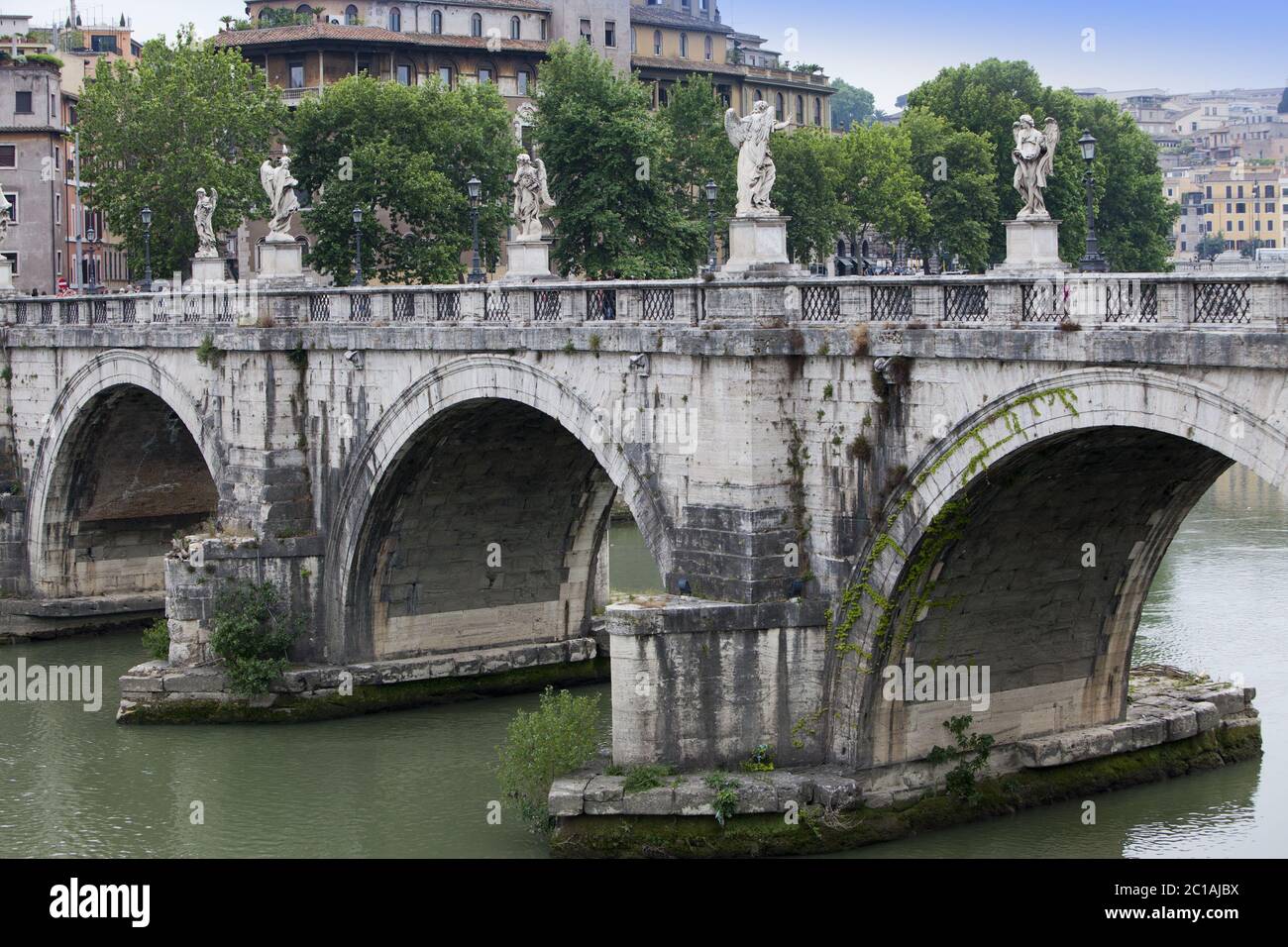 Italy. Rome. The bridge with sculptures over River Tiber to castle ...