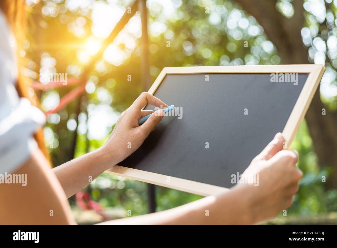 Hands use chalk for drawing, writing balckboard in the parks. Education ...