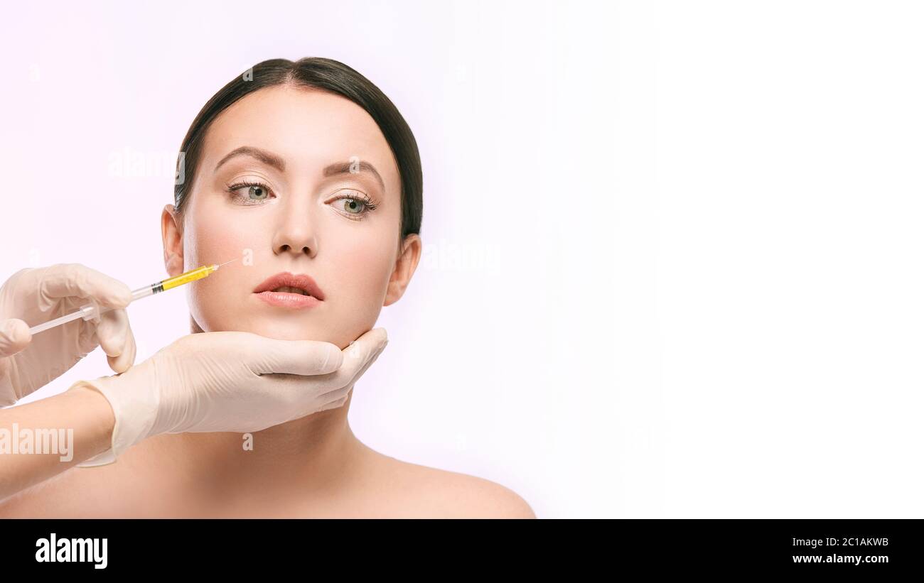 woman face injection. salon cosmetology procedure. skin medical care ...