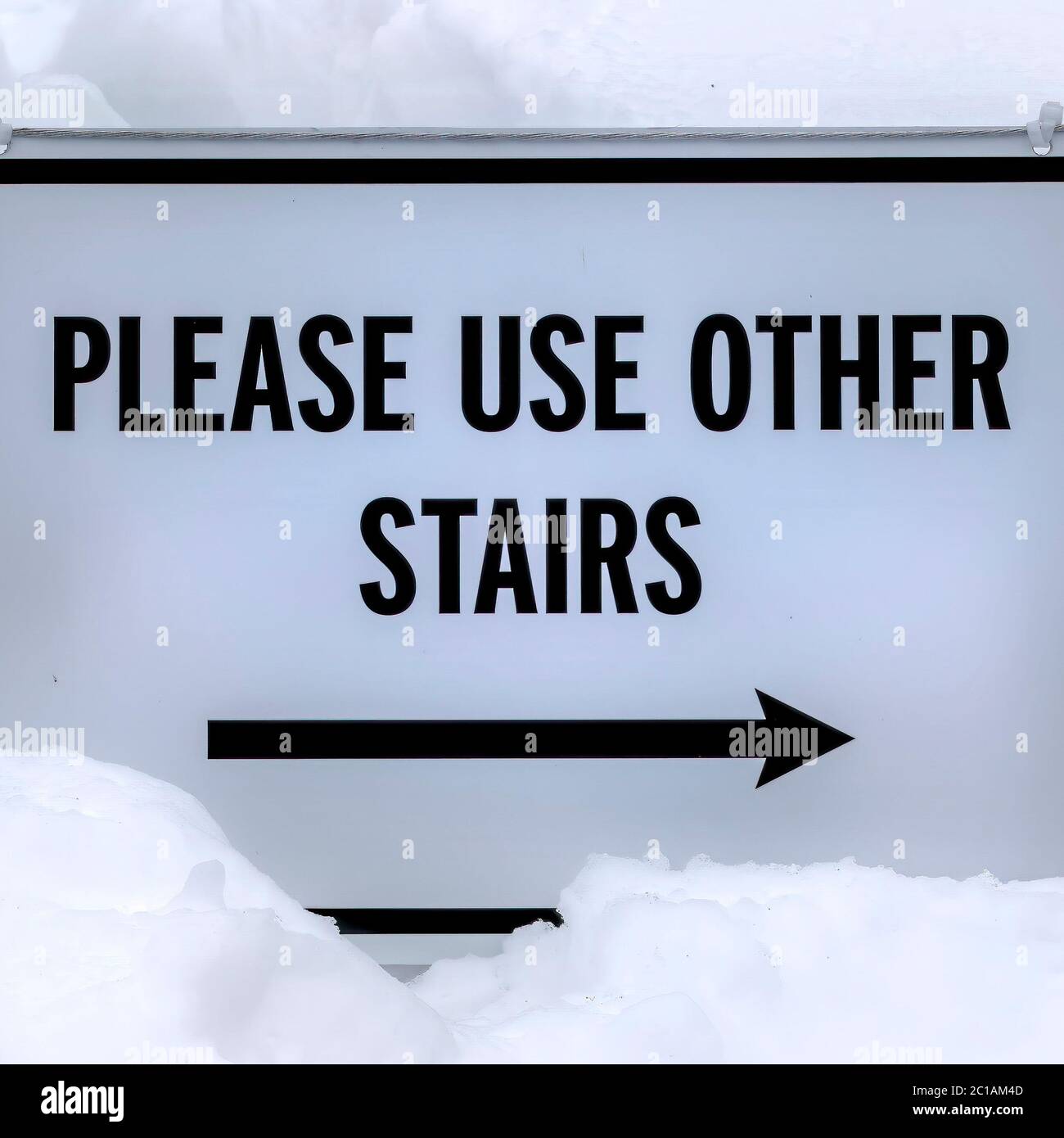 Square frame Sign that reads Please Use Other Stairs against fresh ...