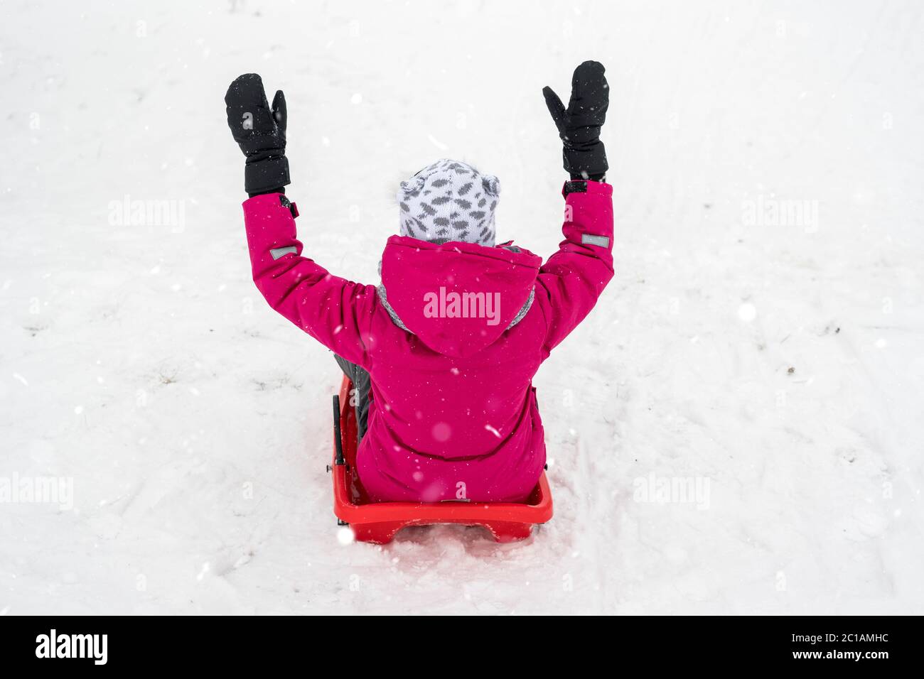 Girl ride on sledge hi-res stock photography and images - Alamy