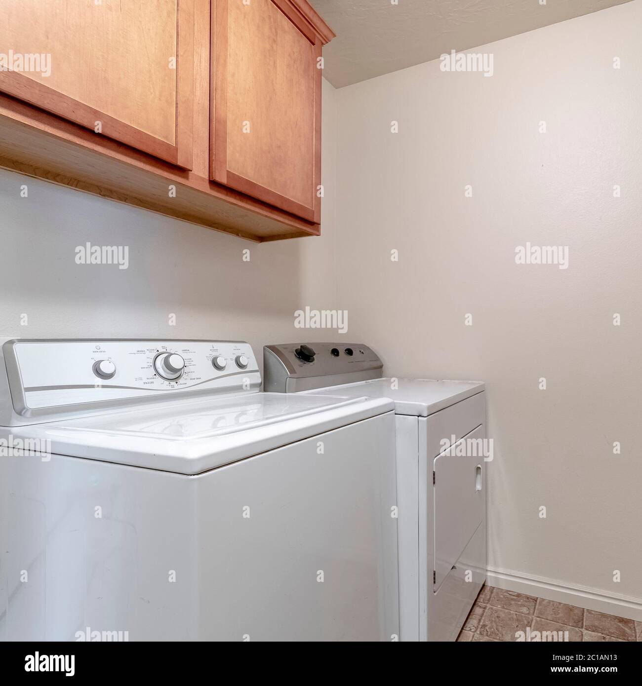Square Laundry interior with washer and dryer interior Stock Photo - Alamy